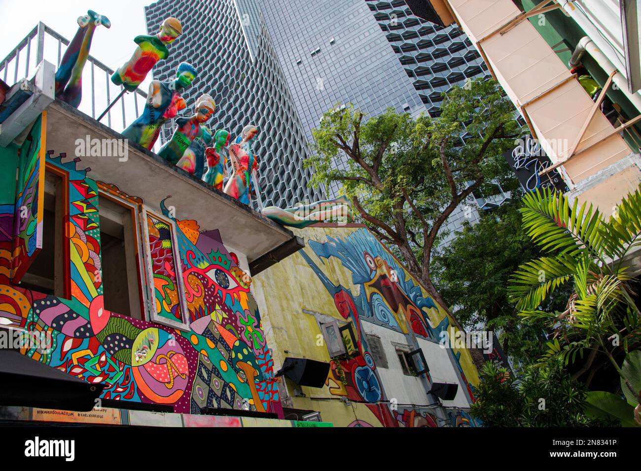 Street view with colorful street art painted murals in Singapore Stock ...