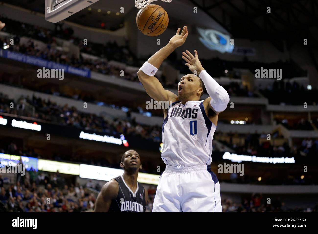 Dallas Mavericks' Shawn Marion (0) dunks as Orlando Magic's Andrew ...