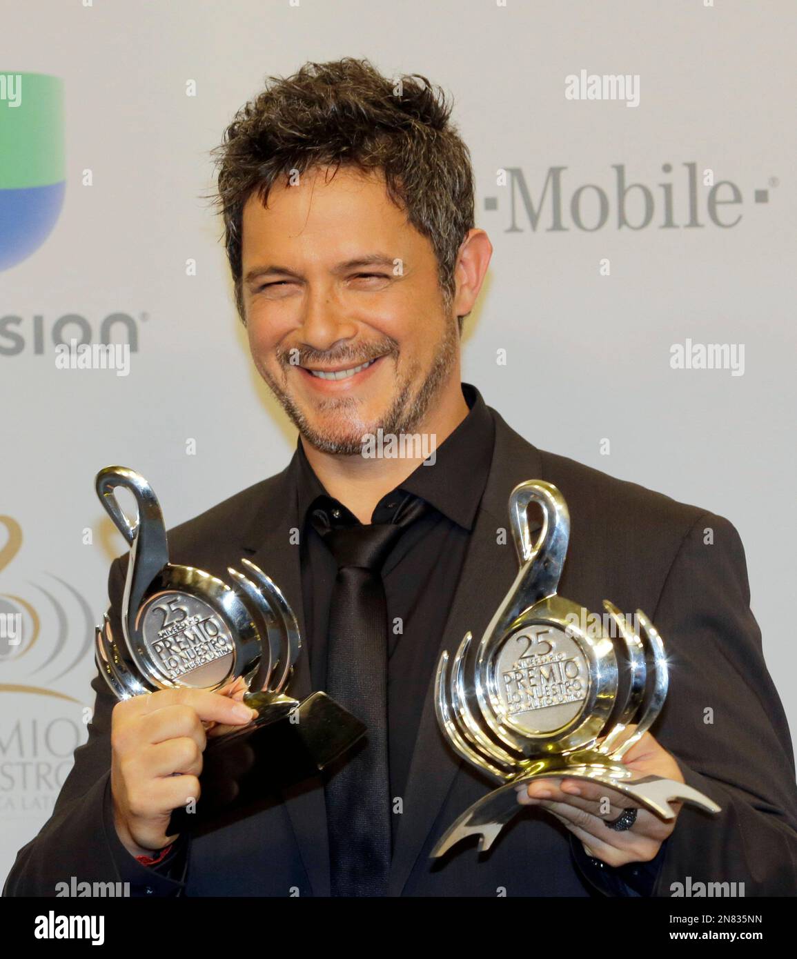 Spanish pop/ballad musician Alejandro Sanz shows his two awards at the ...