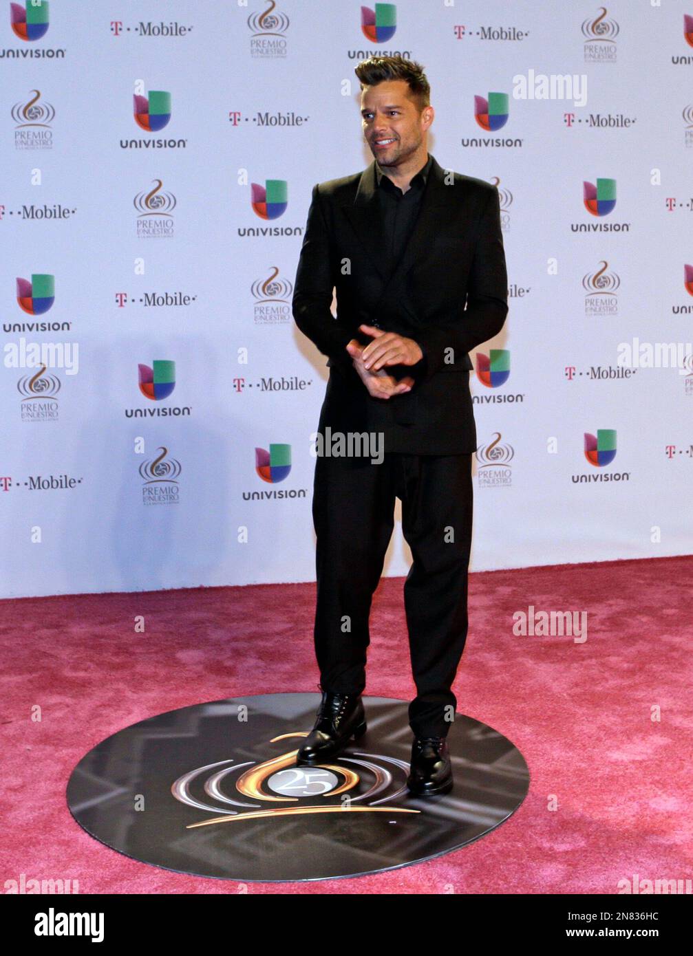 Puerto Rican singer Ricky Martin poses for photographers on the red ...
