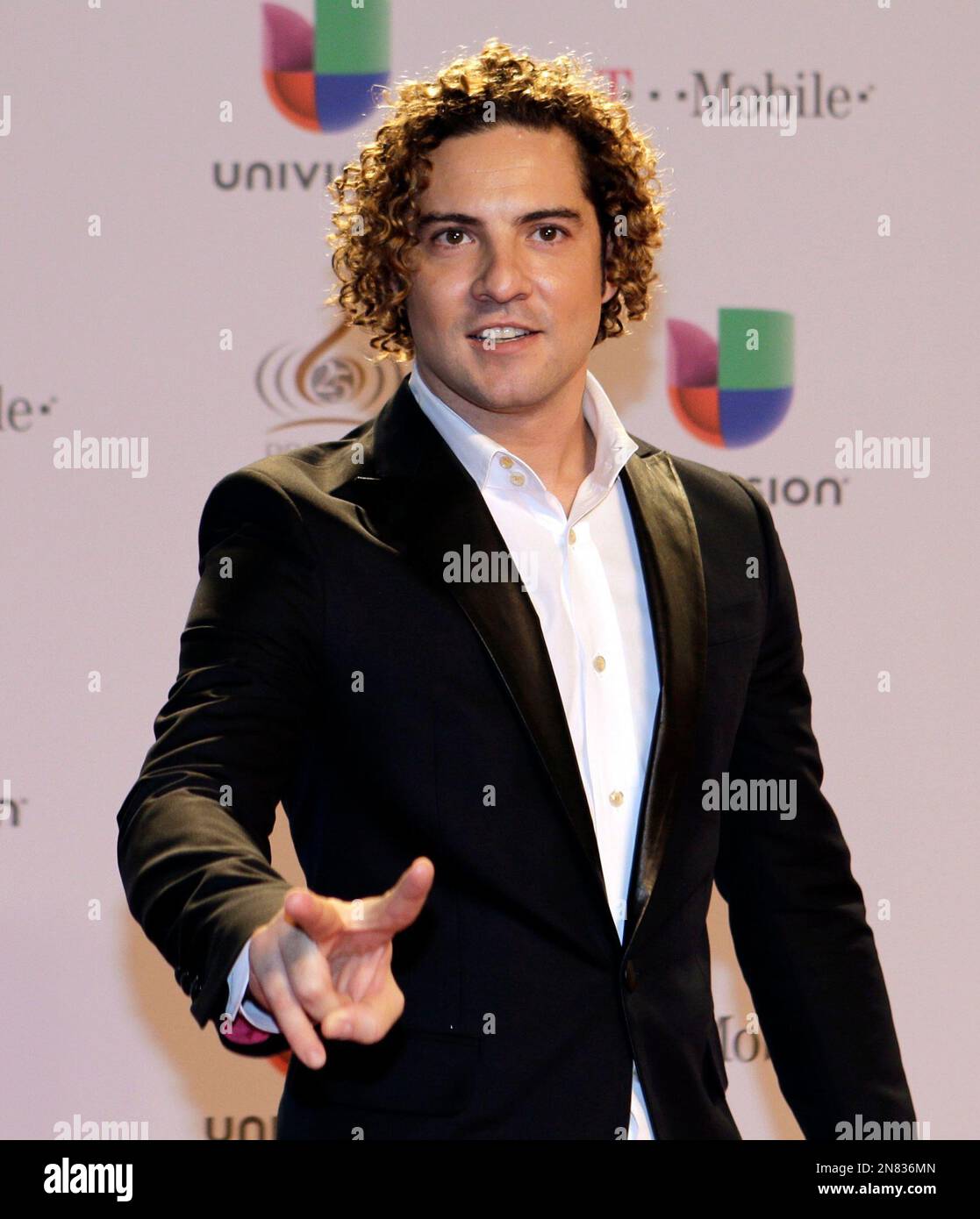Spanish pop singer David Bisbal gives the "V" sign as he walks on the ...