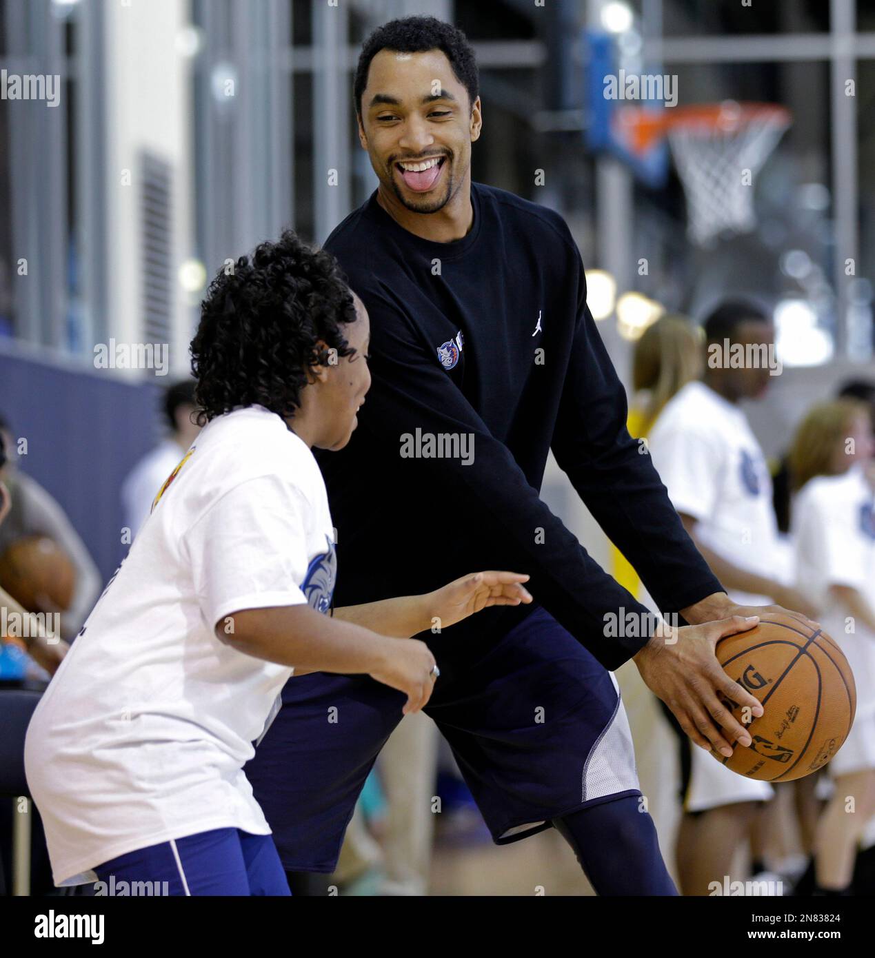 Charlotte Bobcats' Gerald Henderson, back, guards the ball from an ...