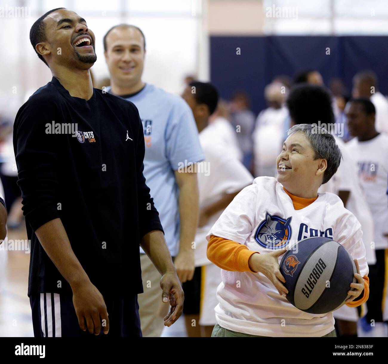 Charlotte Bobcats' Ramon Sessions, left, shares a laugh with Colleen ...