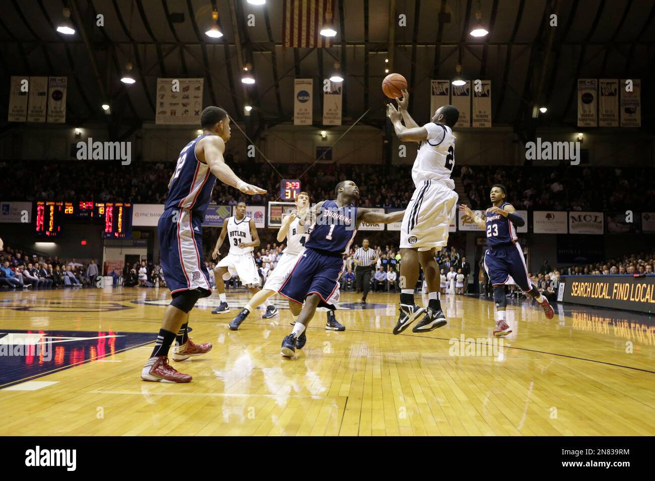 Butler forward Roosevelt Jones, right, shoots over Duquesne guard ...