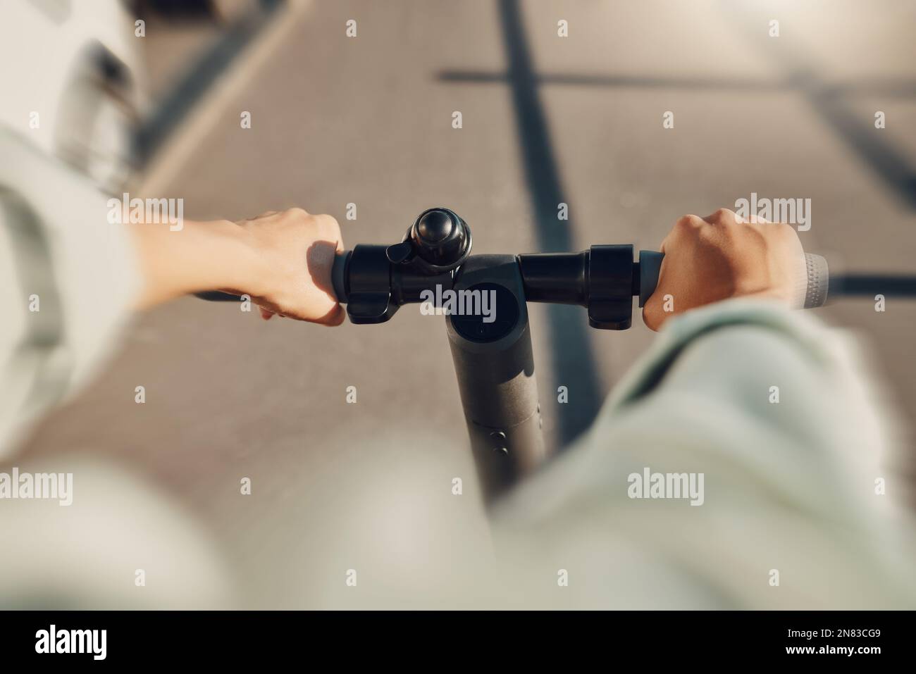 Electric scooter, travel and person hands driving on urban street for ...
