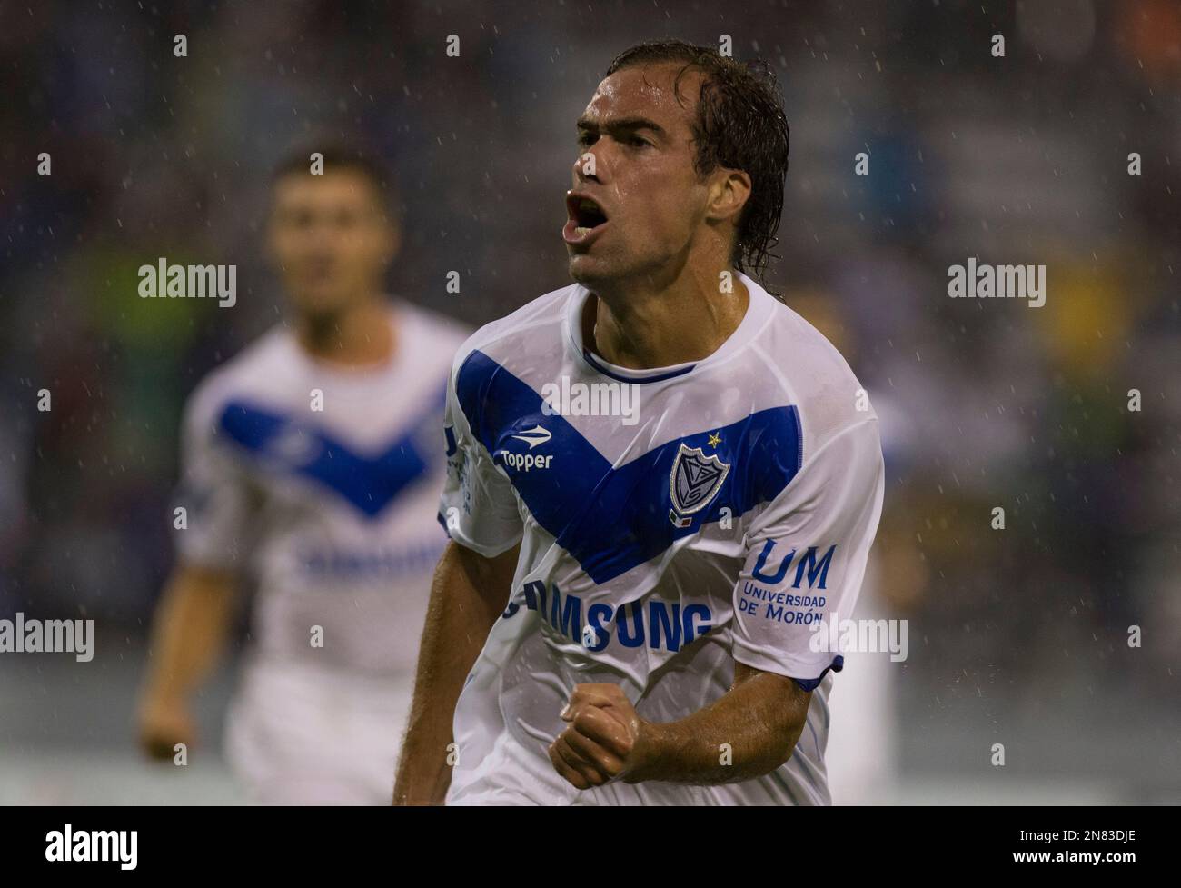 Under pouring rain, Argentina's Velez Sarsfield's Federico Insua ...