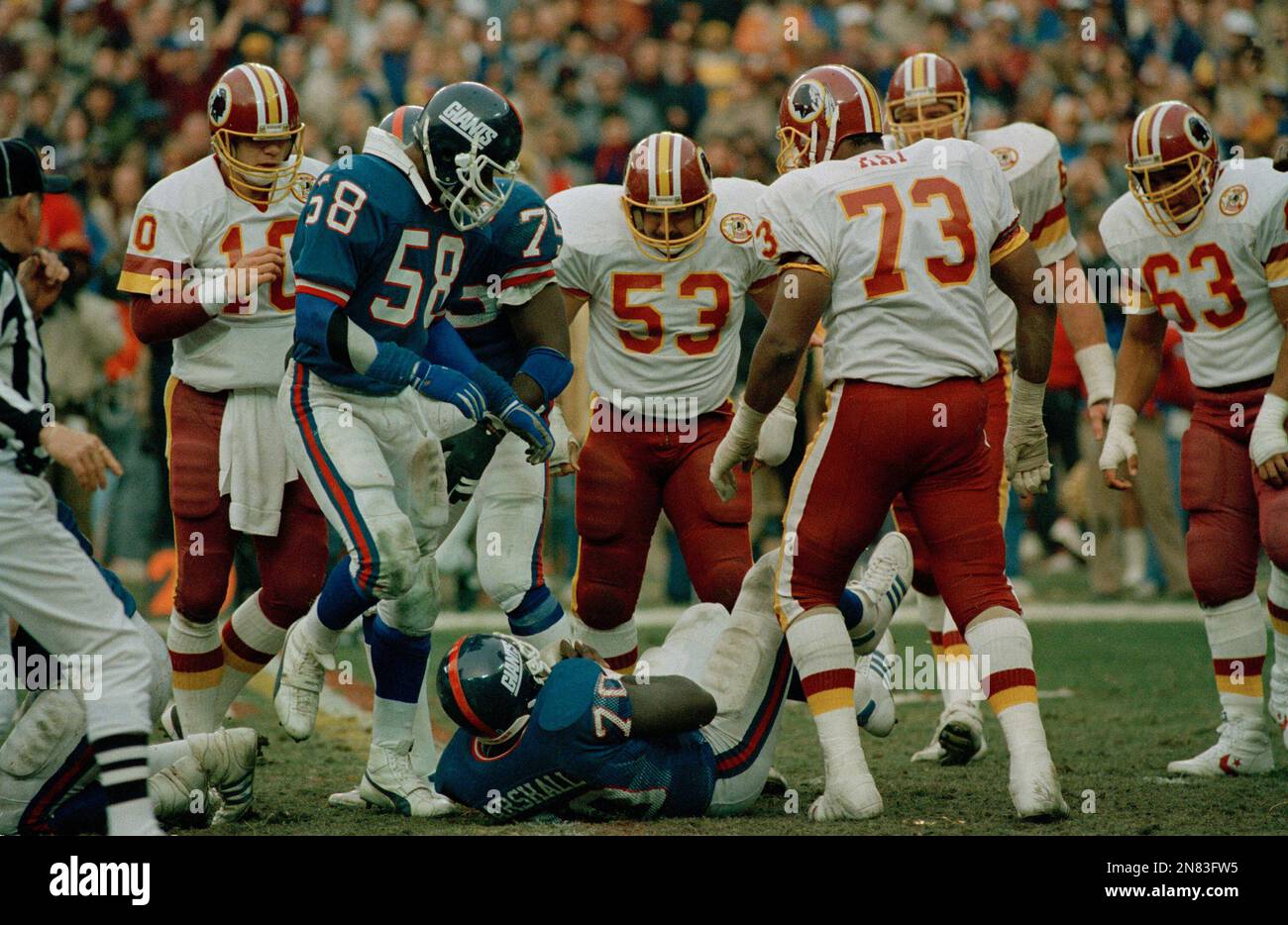 Washington Redskins quarterback Jay Schroeder (10) and linebacker Harry ...