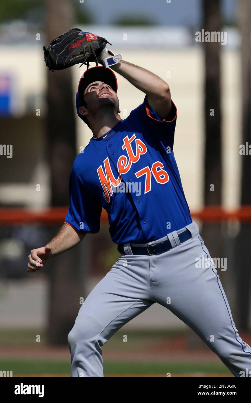 New York Mets non-roster invitee infielder Josh Satin works on pop up ...