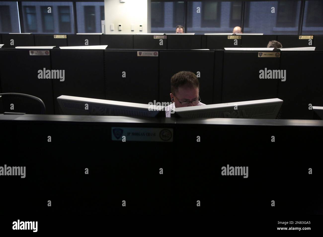 In this Tuesday, Feb. 19, 2013 photo, police officers monitor computer ...