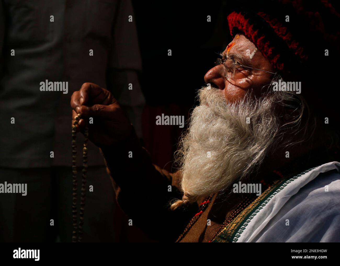 Indian Hindu holy man Swami Ramanand Das prays inside his tent at ...