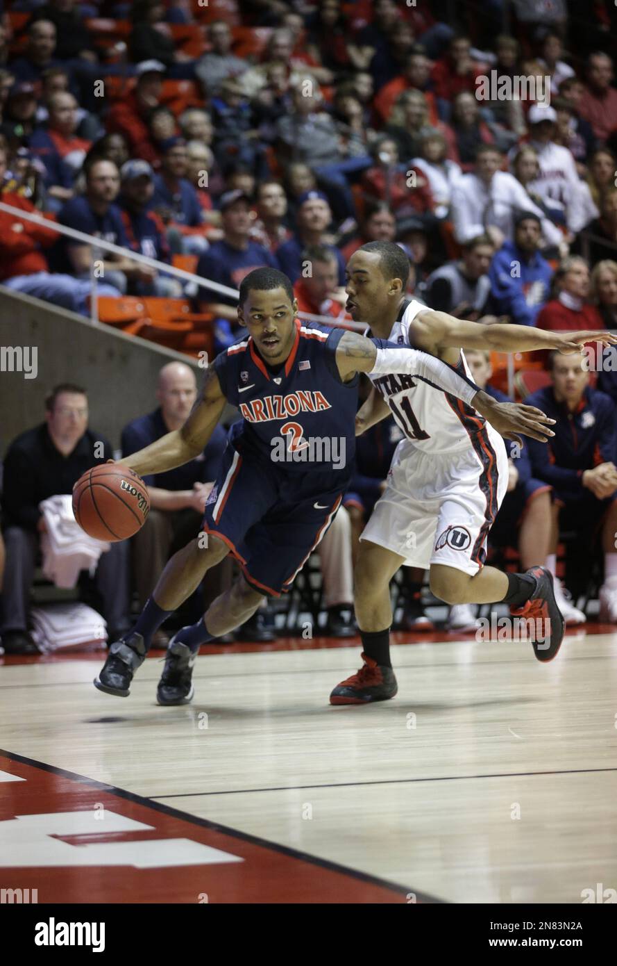 Arizona's Mark Lyons (2) drives around Utah's Brandon Taylor (11) in ...