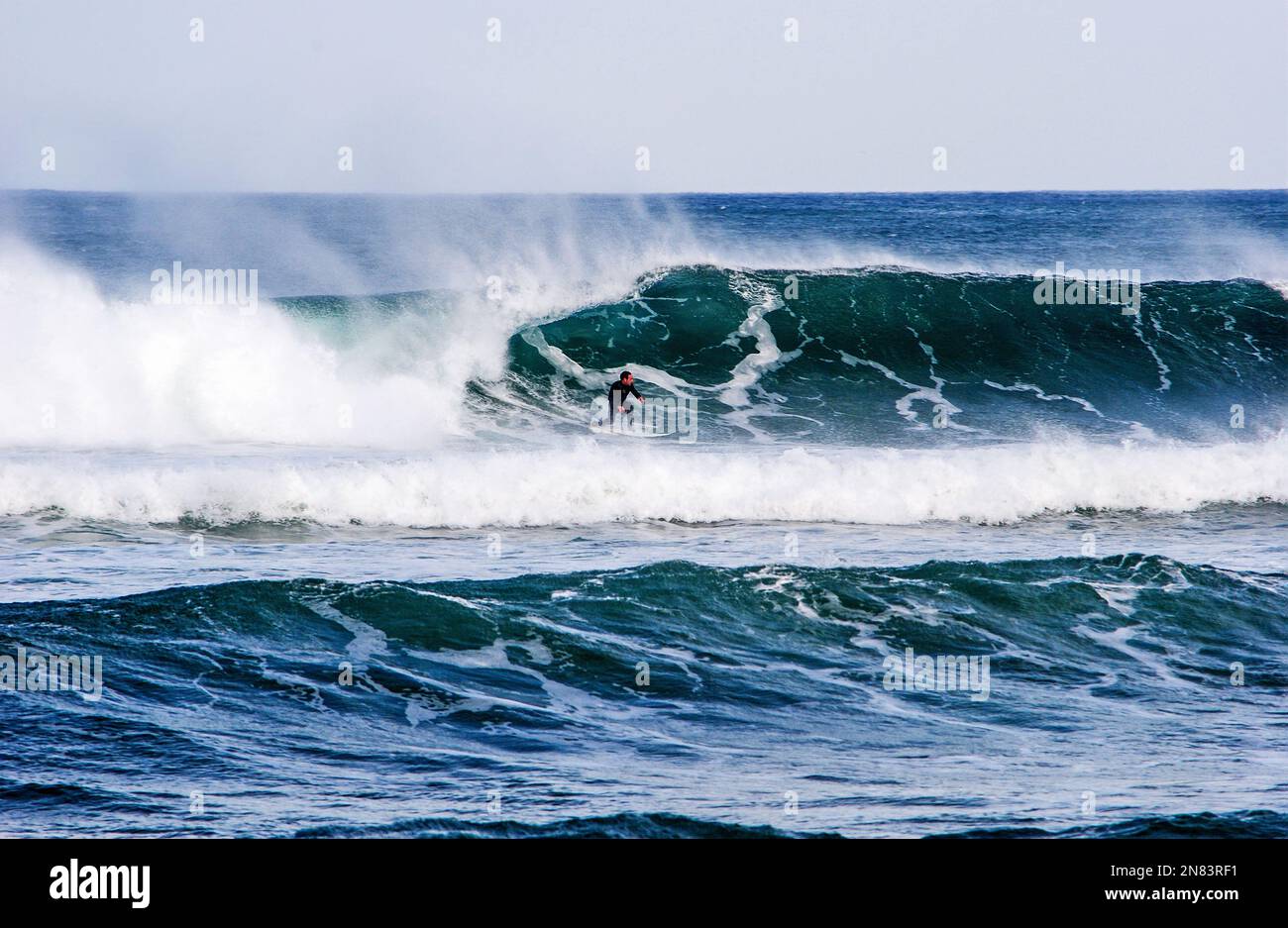 Surfer surfing the sea of Spain, with a beautiful tube. Presence of ...