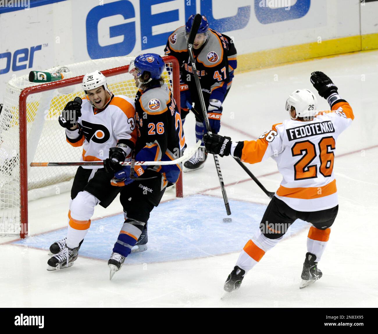 Philadelphia Flyers' Zac Rinaldo, left, celebrates his goal with Ruslan ...