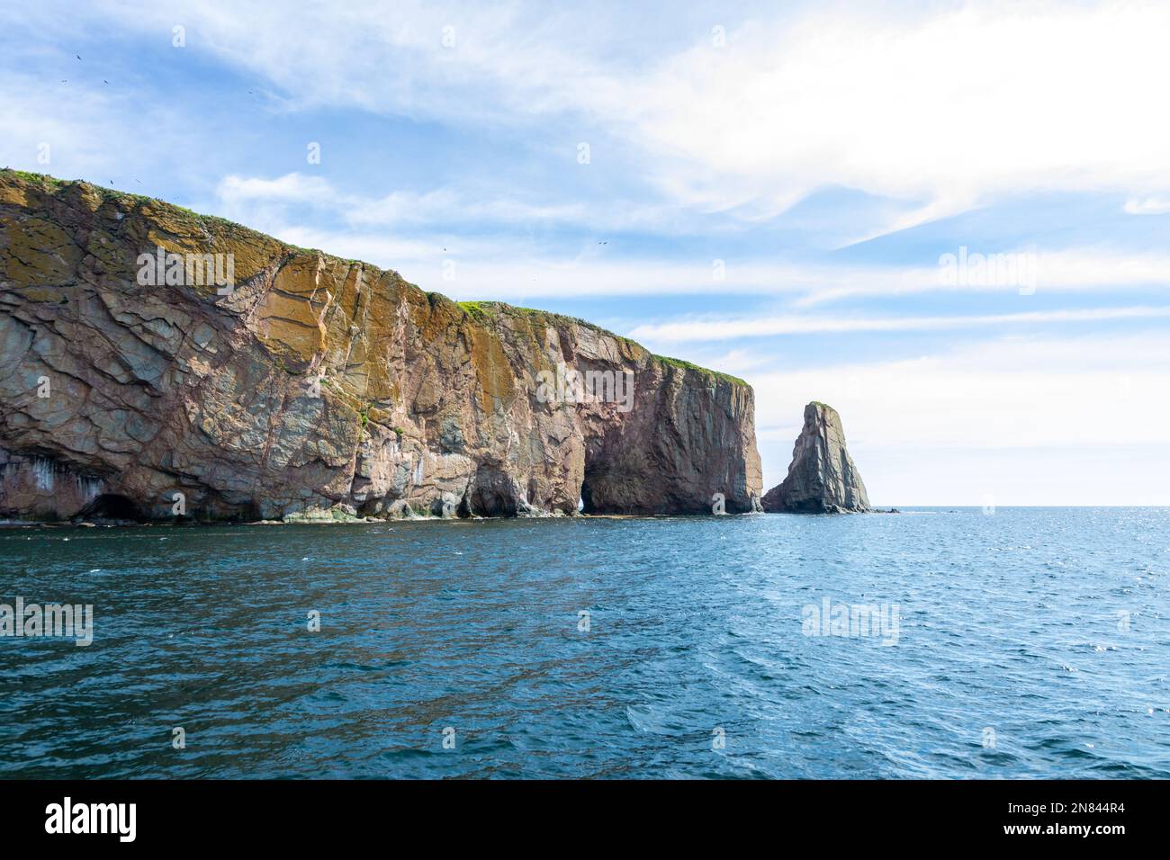 View of Percé Rock, a huge sheer rock formation in the Gulf of Saint ...