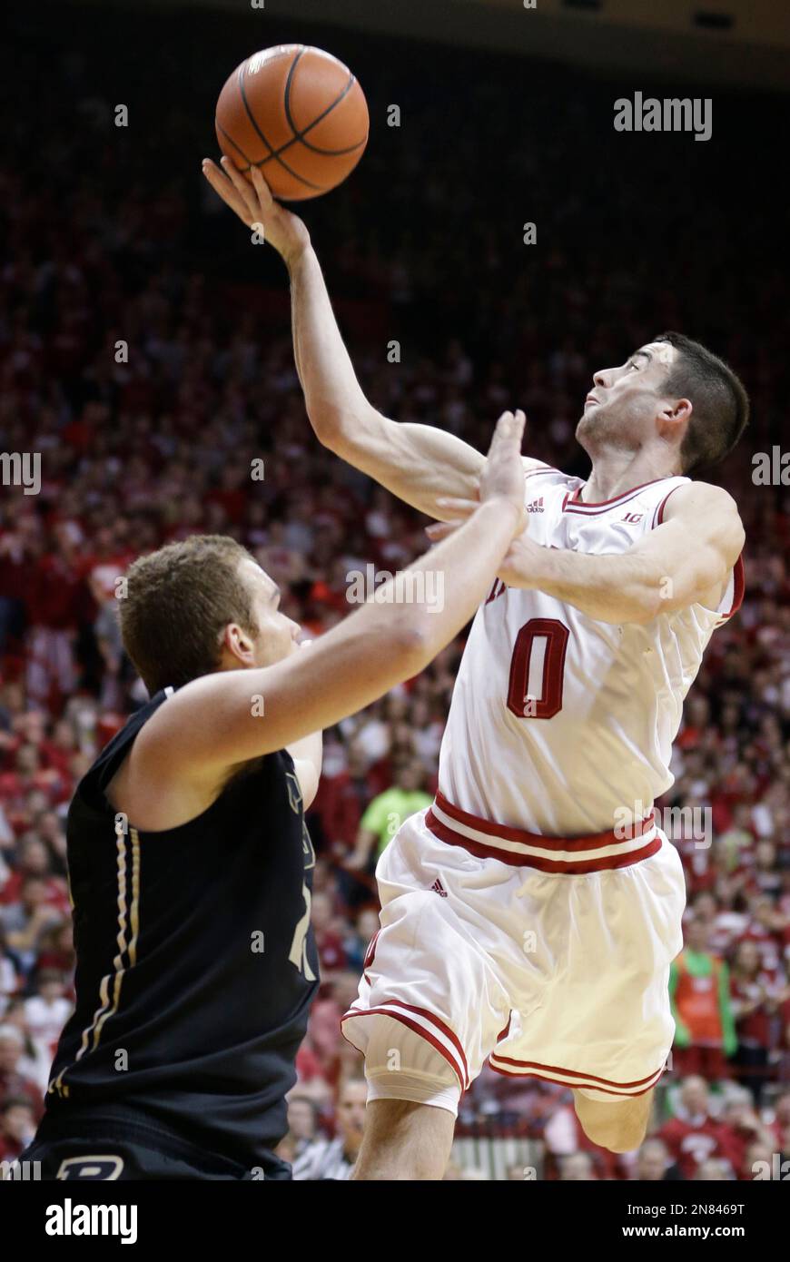 Indiana forward Will Sheehey, right, hits a shot over Purdue guard D.J ...
