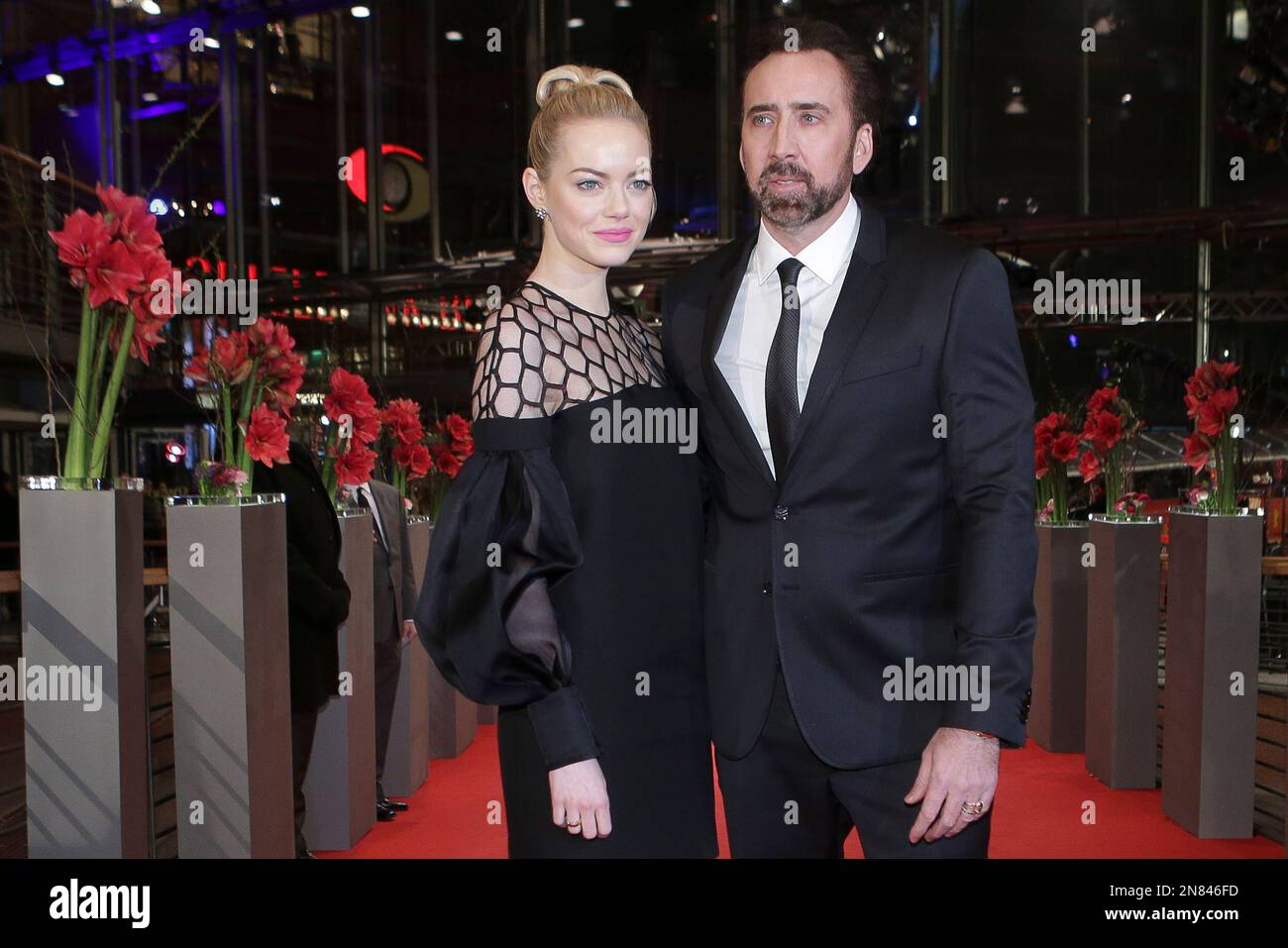 Actors Emma Stone, left, and Nicholas Cage arrive for the screening of ...