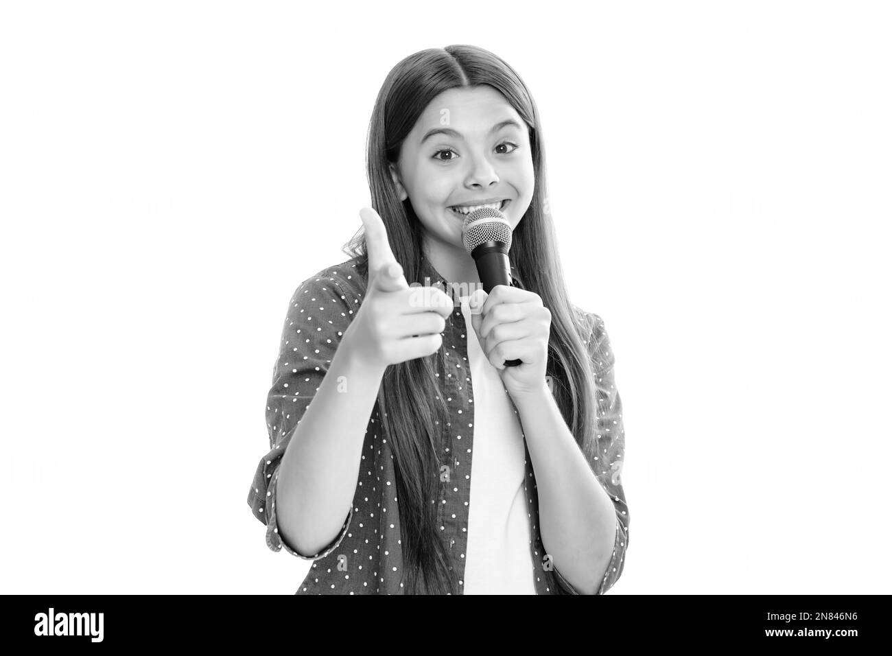 Kid singing. Emotional amazed teen girl with microphone singing against ...