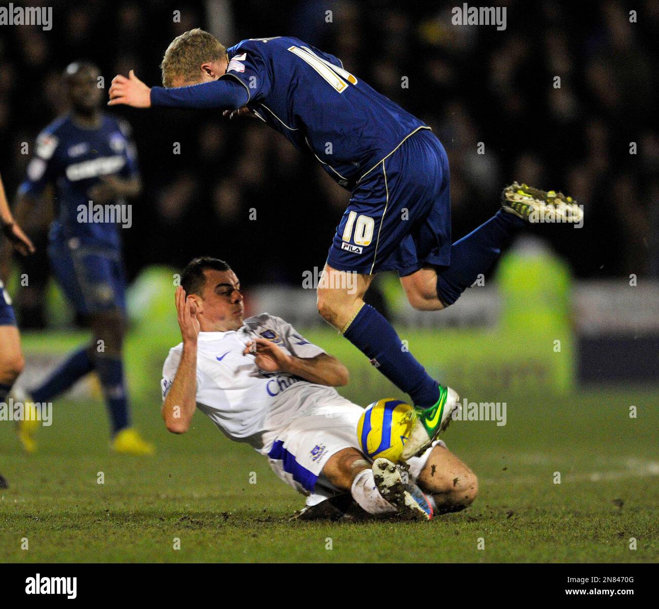 Oldham Athletic's Robbie Simpson right, is tackled by Everton's Darron ...
