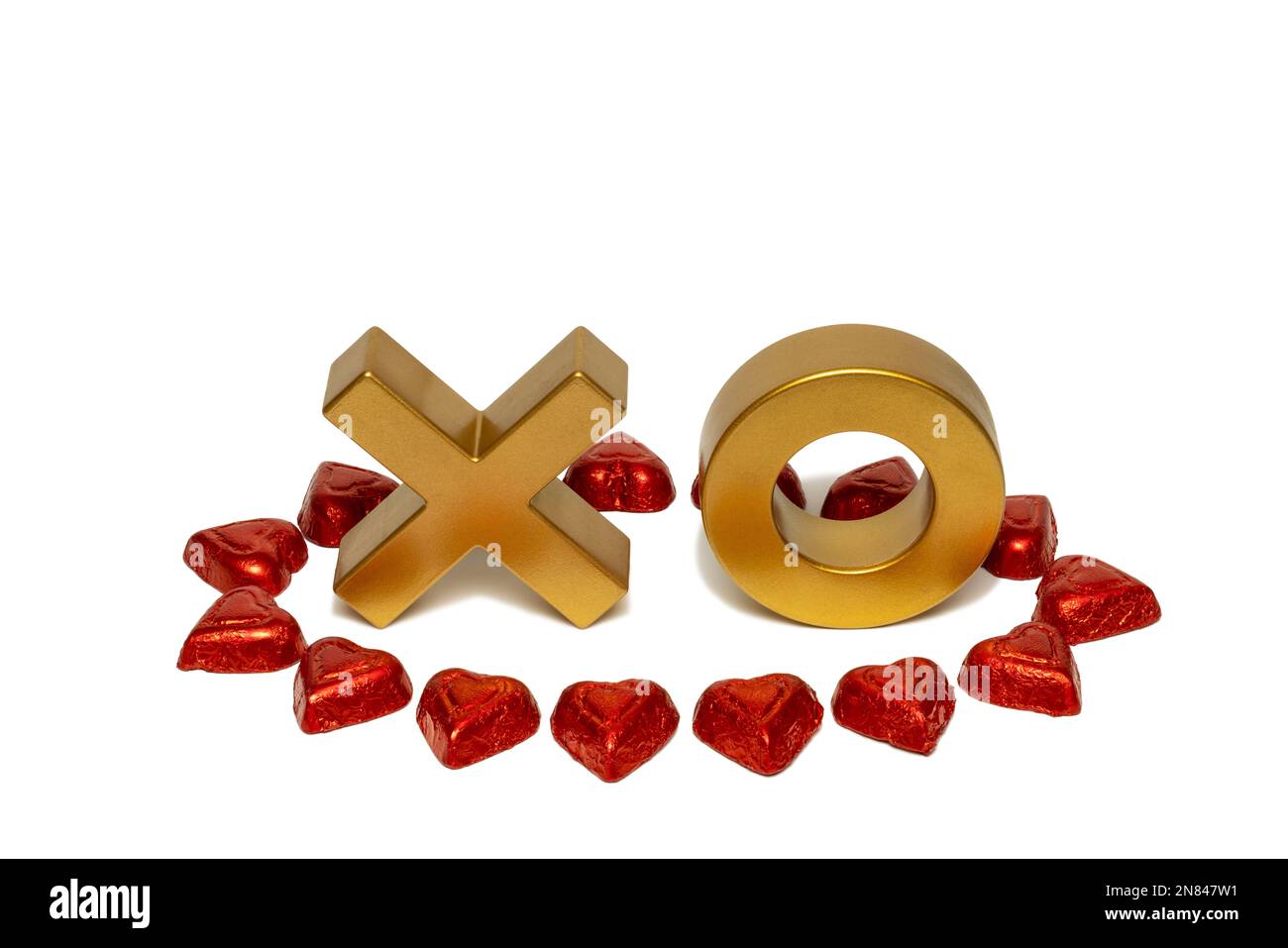 X and O with Chocolate Hearts In Red Foil Stock Photo - Alamy