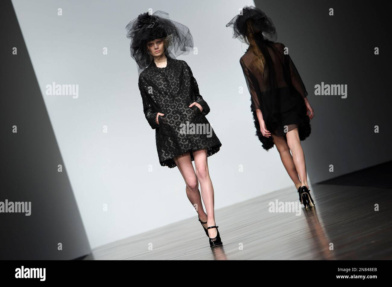 Models wear a design from the John Rocha collection during London ...