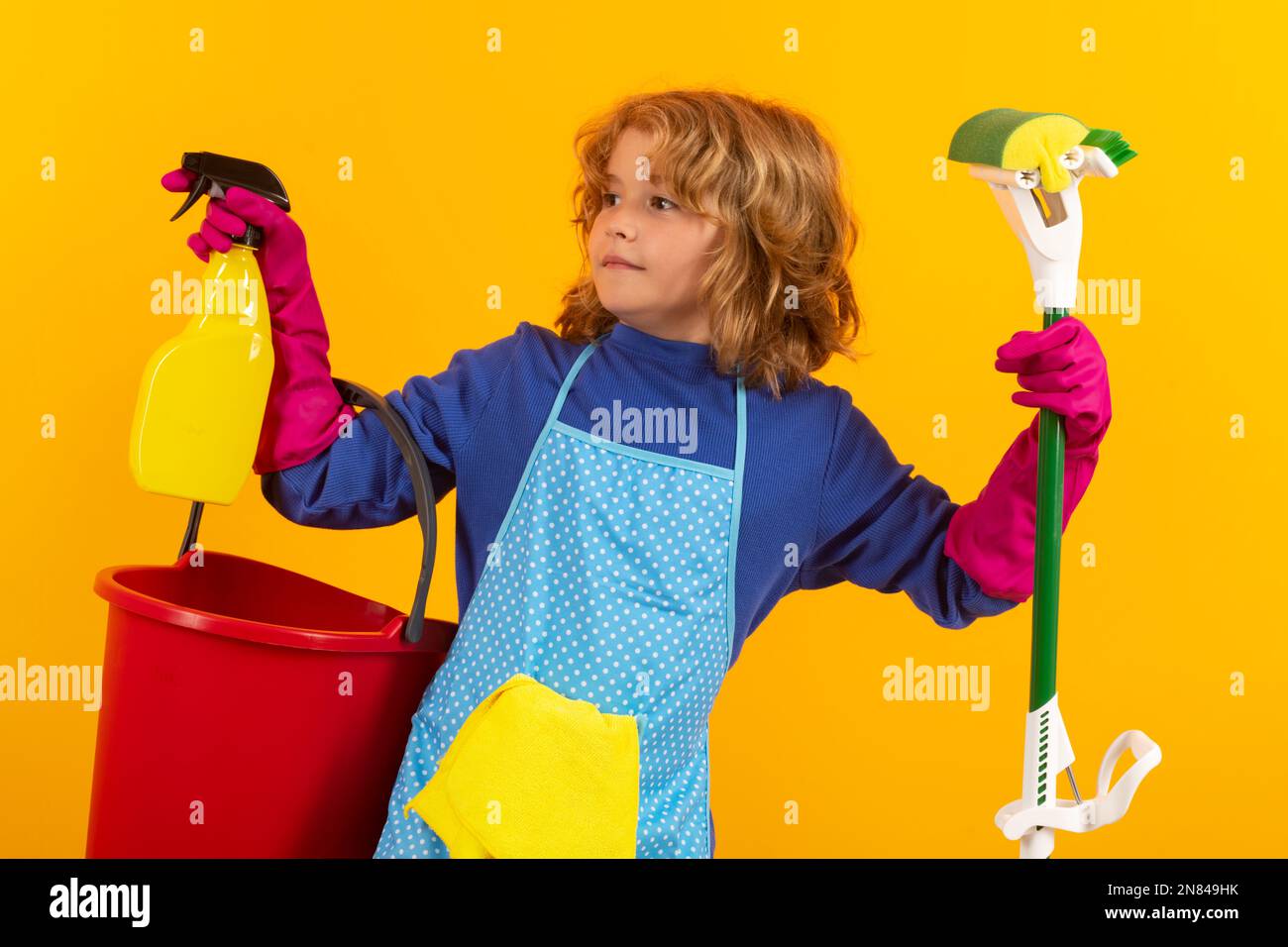 Kid helping with housework, cleaning the house. Cleaning accessory ...