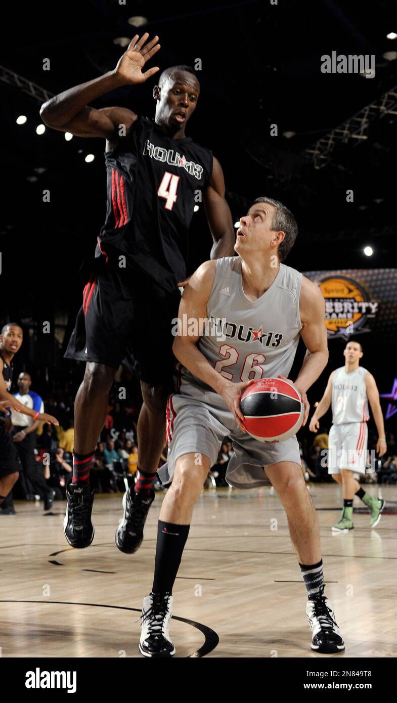Olympic gold medal sprinter Usain Bolt (4) towers over U.S. Education ...