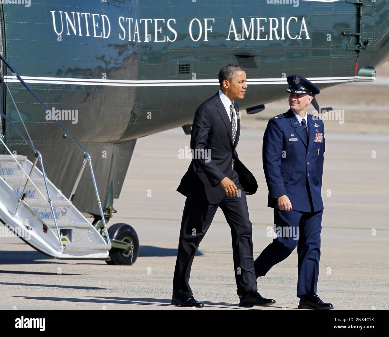 President Barack Obama walks with Air Force Col. William M. Knight, at ...