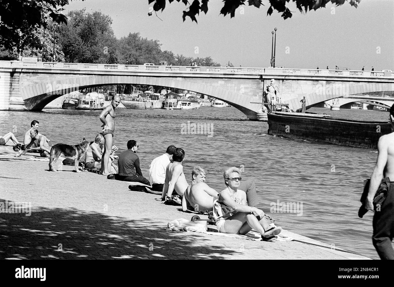 On the banks of the River Seine in France people wearing bathing ...