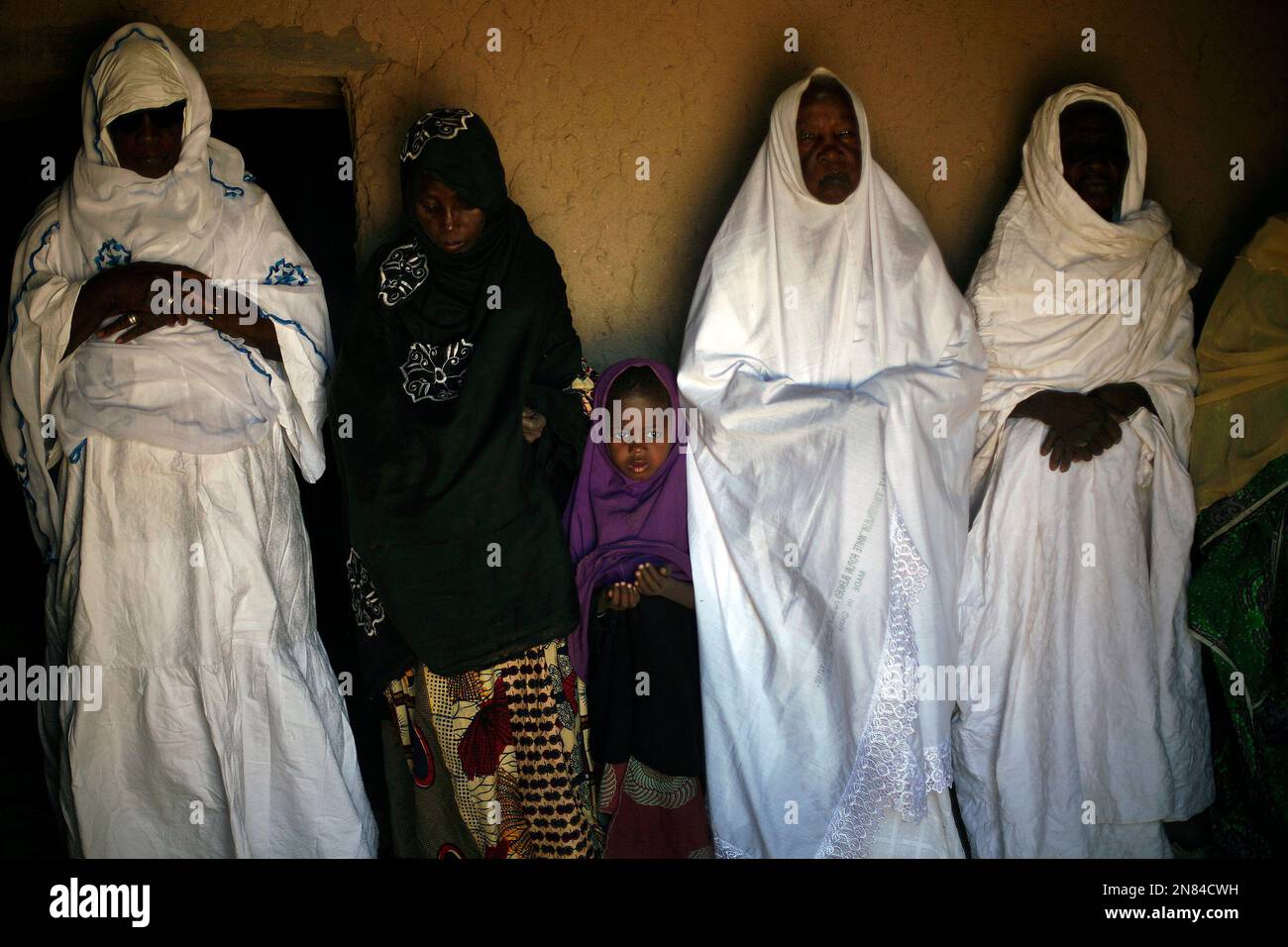 Women pray during the traditional Friday prayer at the Askia mausoleum ...