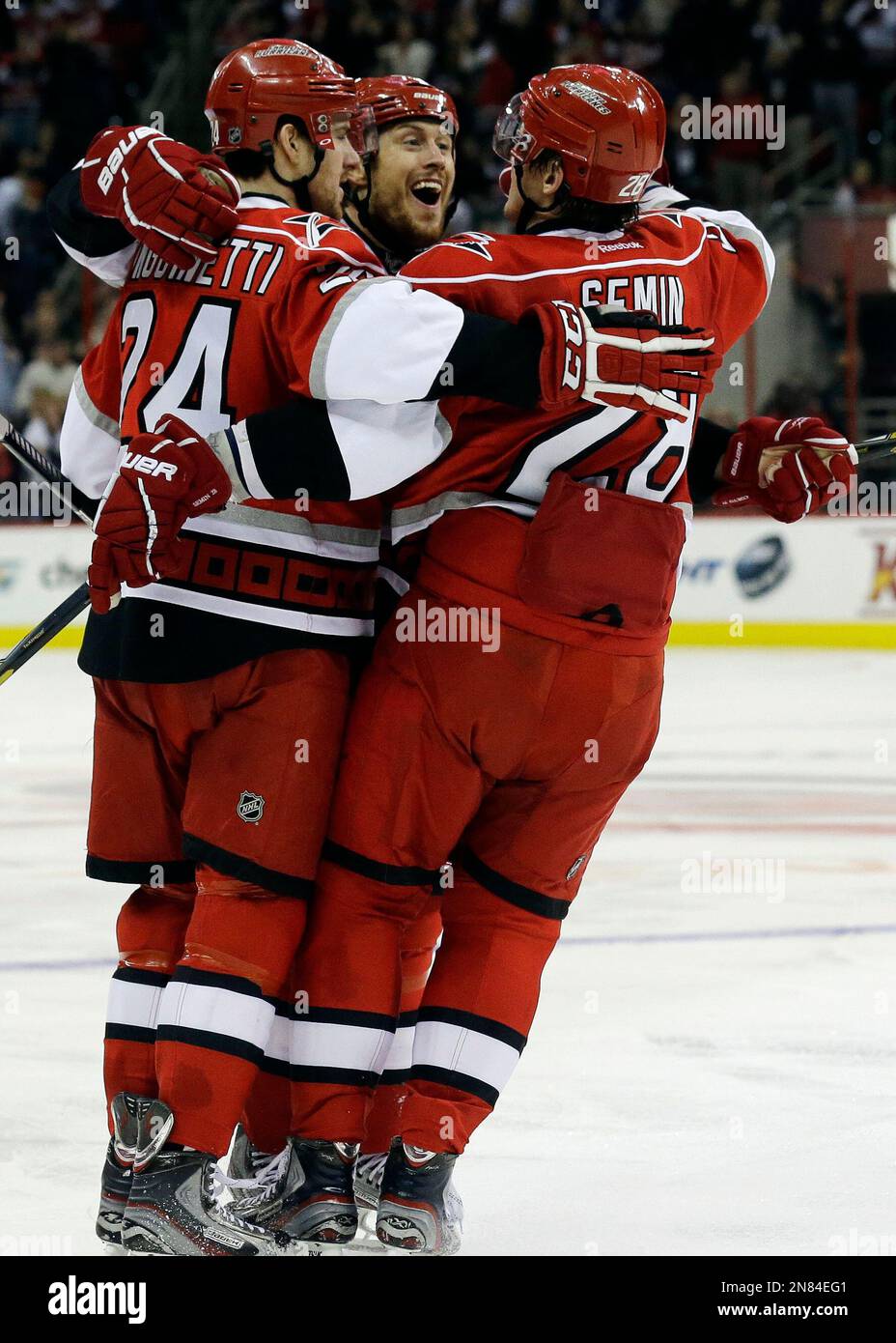 Carolina Hurricanes' Joe Corvo, center, celebrates his goal against the ...