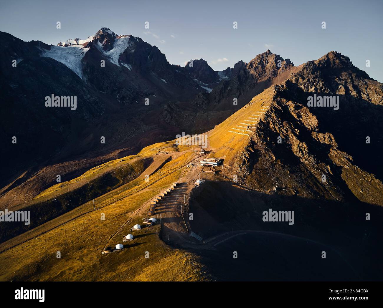 Aerial panorama landscape of the mountain valley with glacier and yurt ...