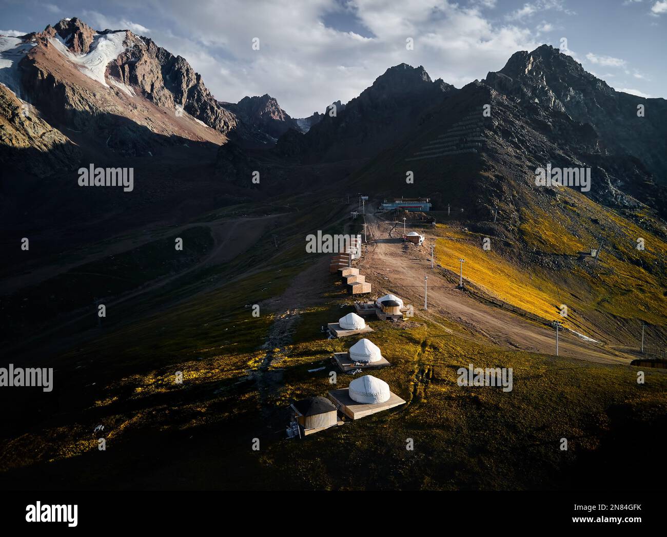 Aerial panorama landscape of the mountain valley with glacier and yurt ...