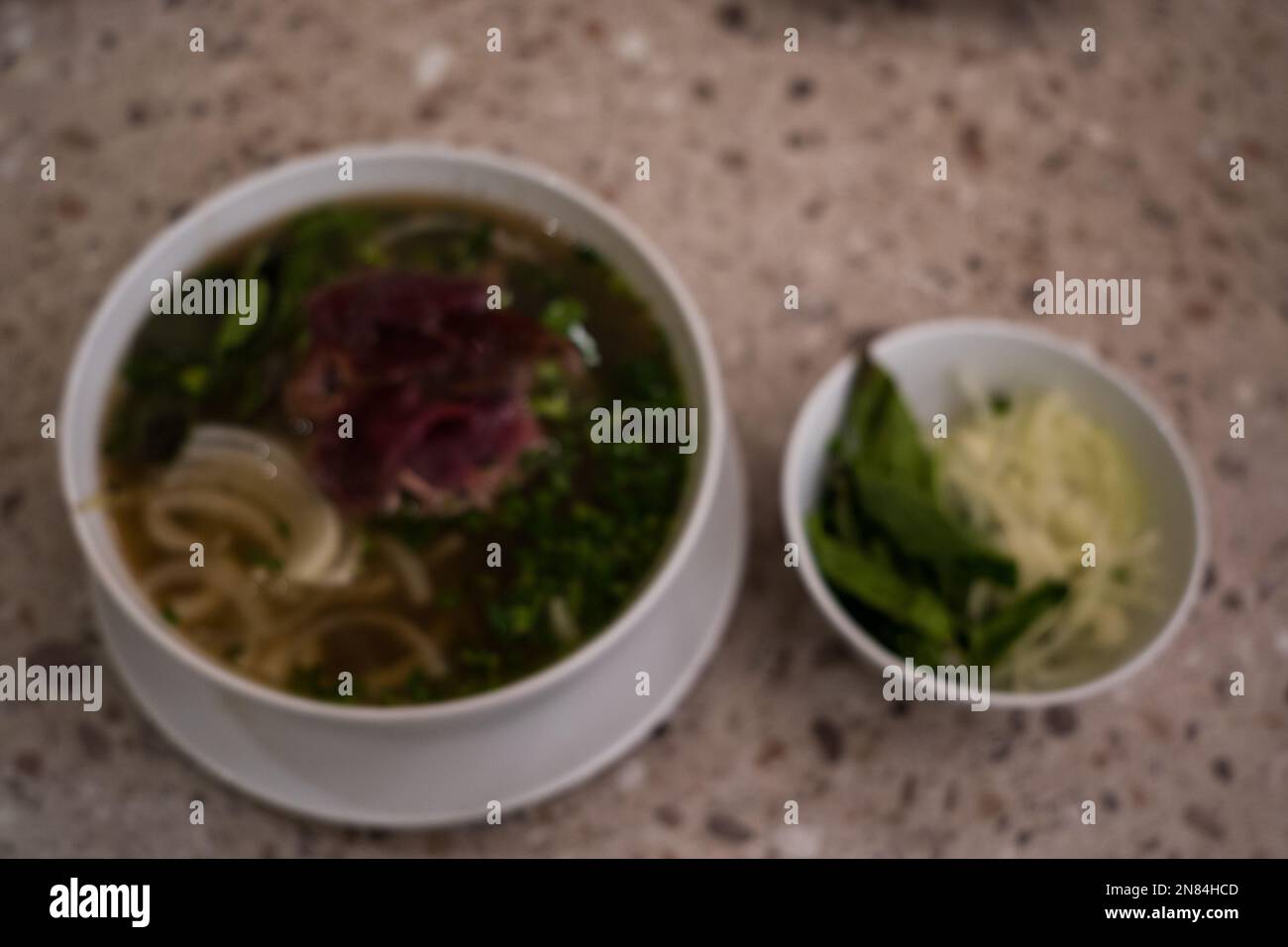 Close up of Vietnamese pho soup with beef, meatball, fresh vegetable ...