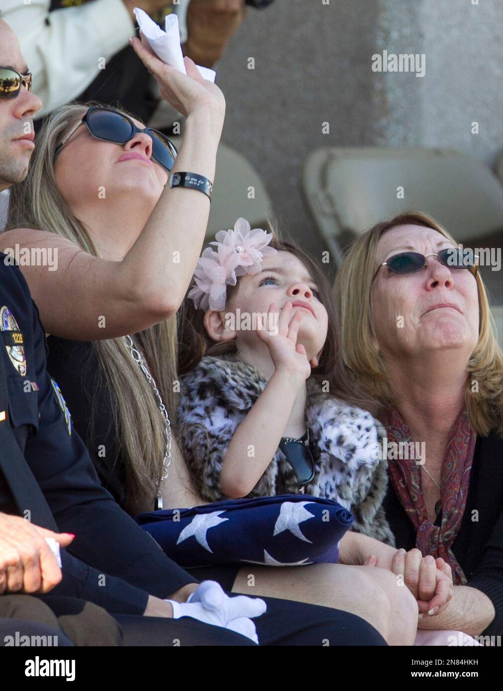 Regina Crain, the widow of Riverside Police officer Michael Crain, left ...