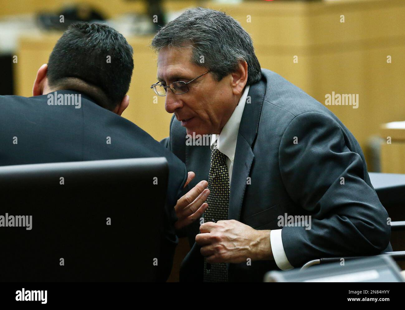 Prosecutor Juan Martinez speaks to a colleague during the Jodi Arias ...