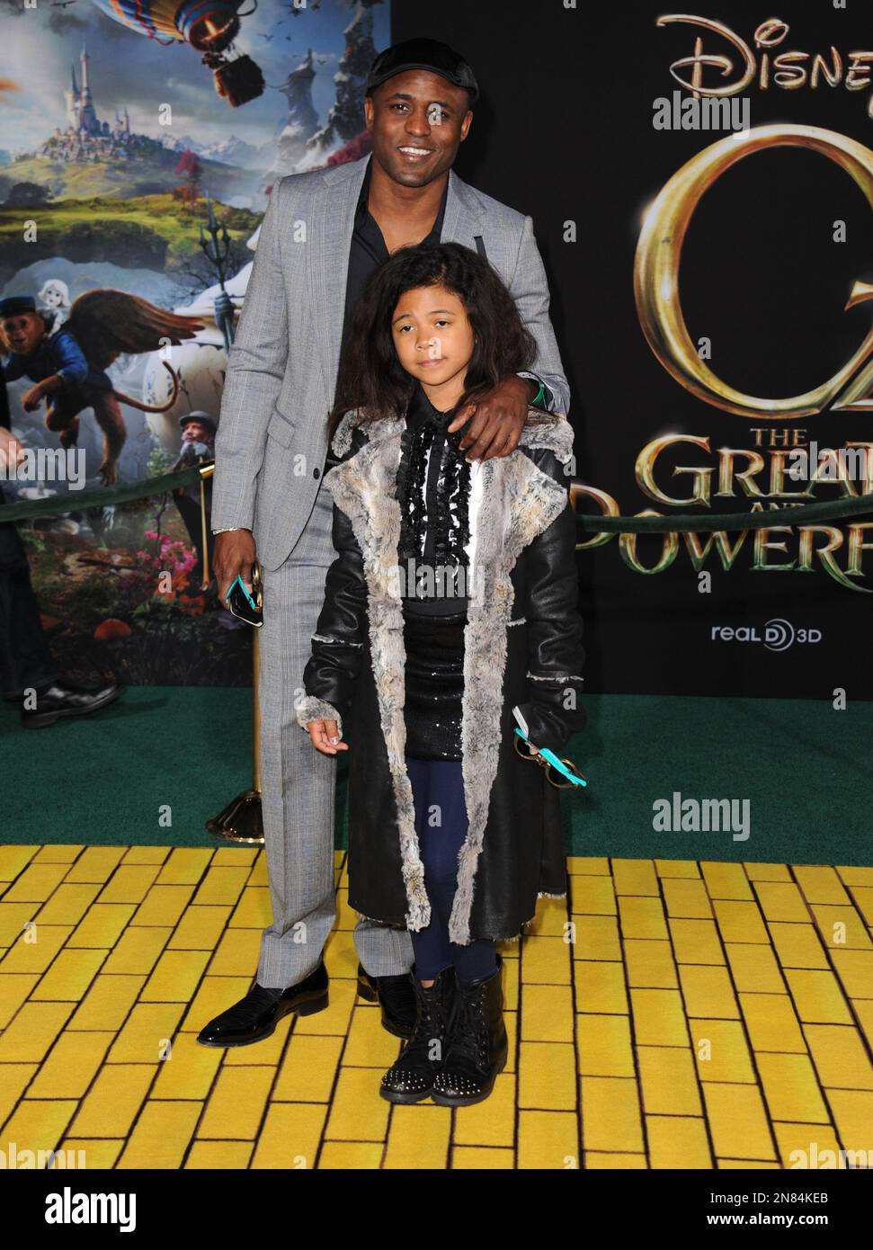 Wayne Brady, left, and his daughter Maile Masako Brady arrive at the ...