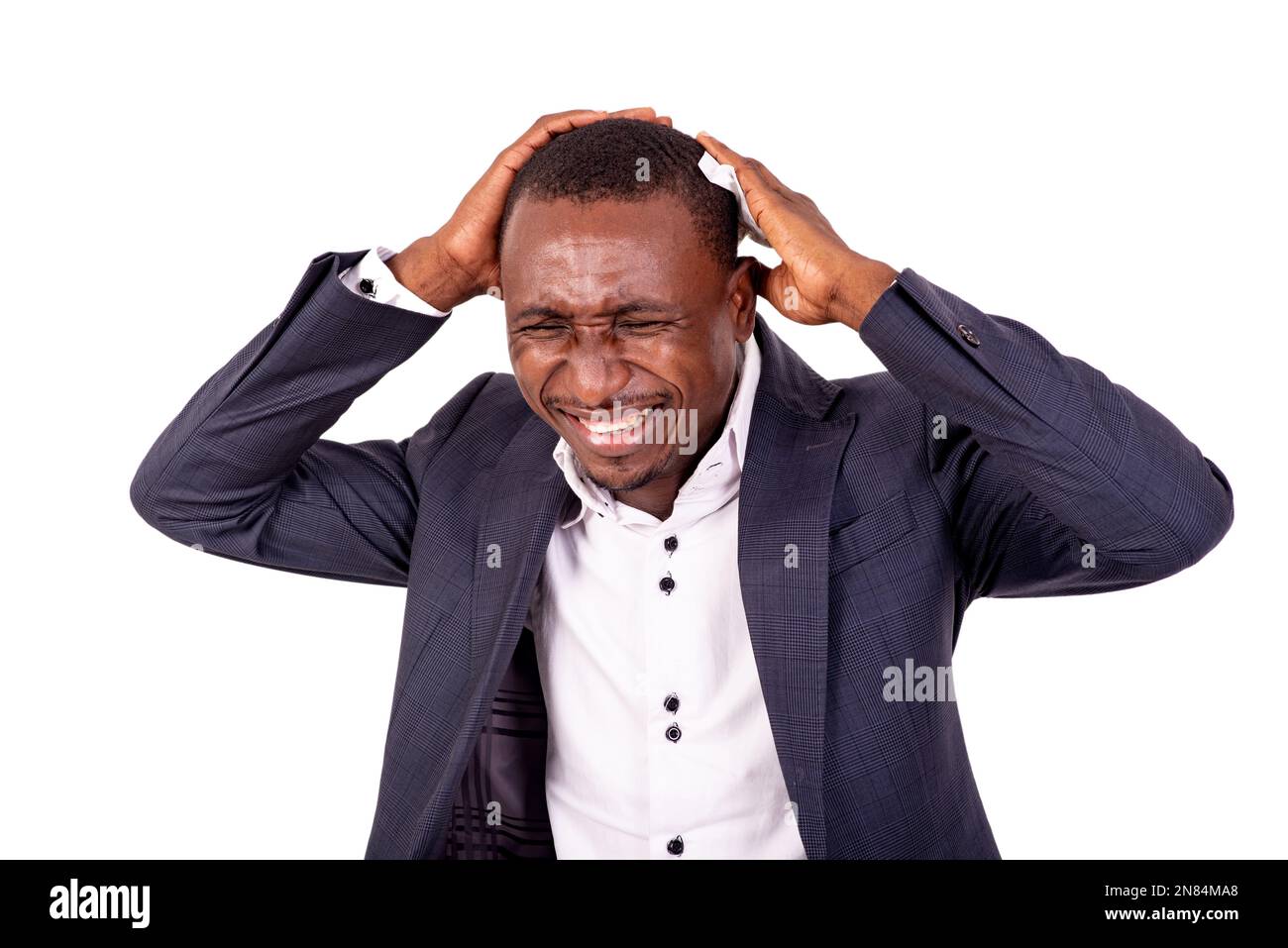 portrait of a young businessman with his hands on his head crying Stock ...