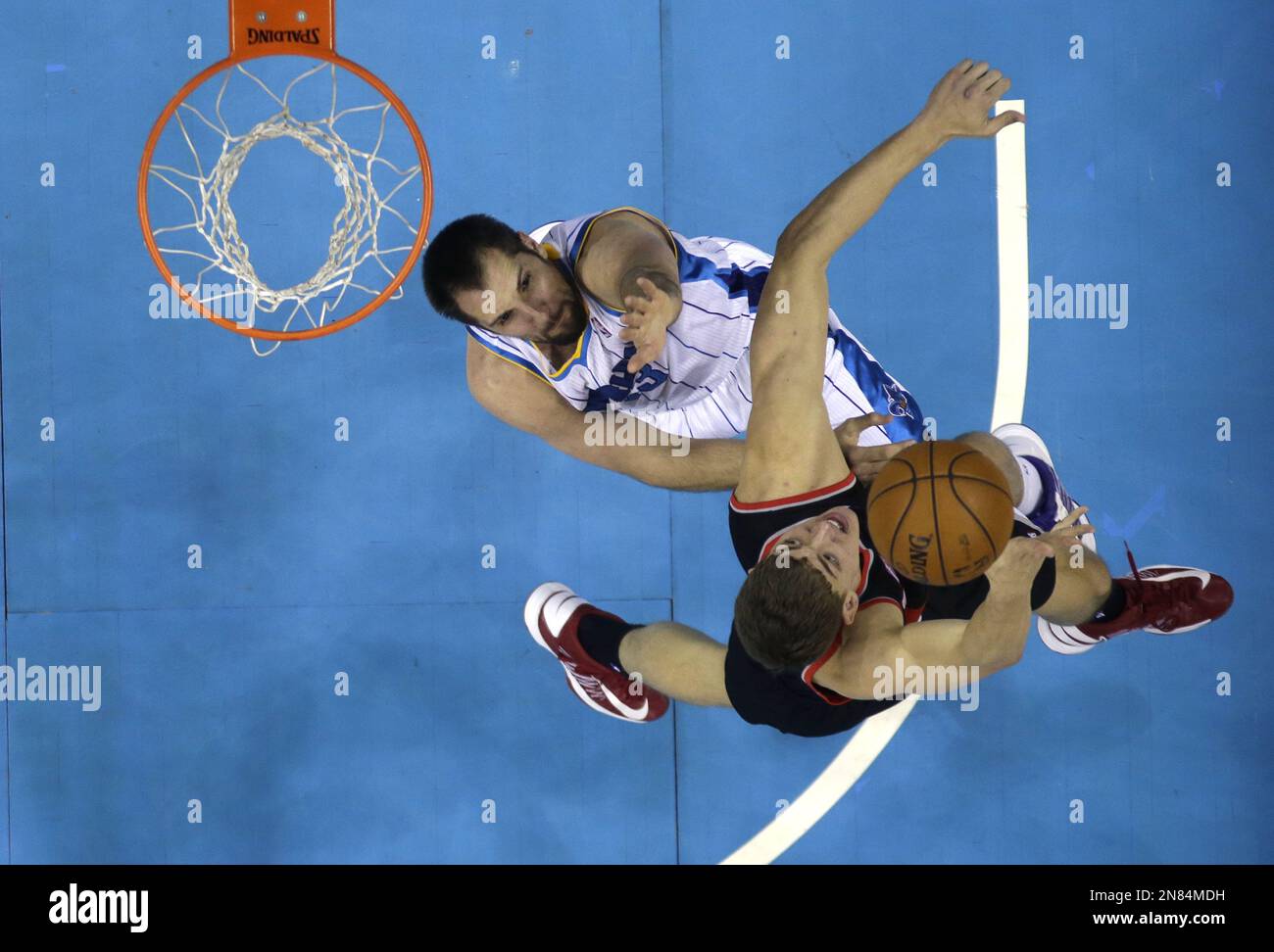 Portland Trail Blazers center Meyers Leonard (11), bottom right, shoots ...