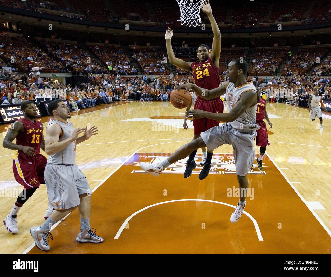 Texas' Sheldon McClellan, right, tries to pass as Iowa State's Percy ...