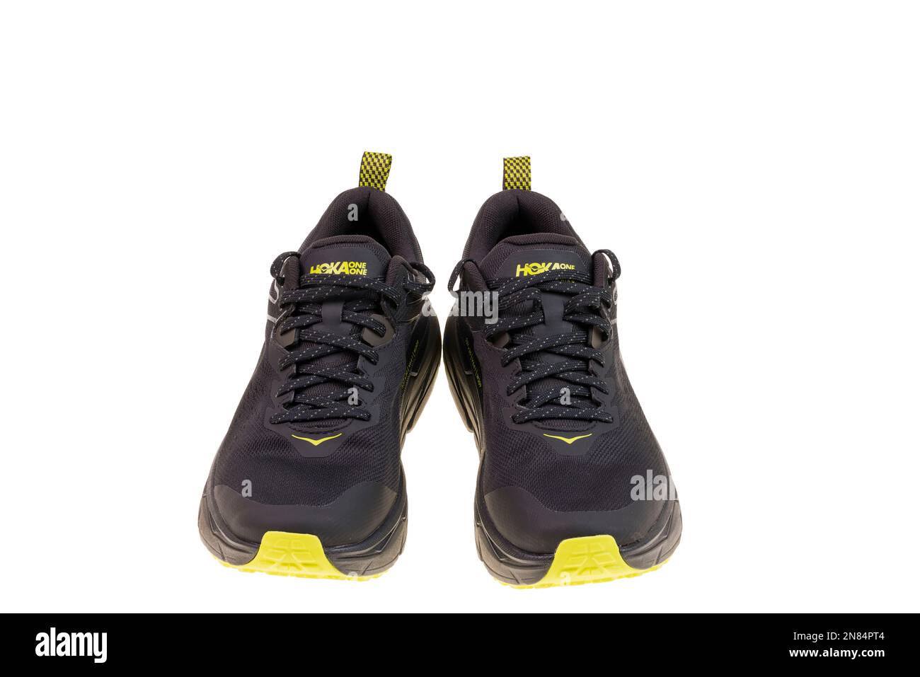 Beautiful view of black yellow Hoka sneakers isolated on white ...