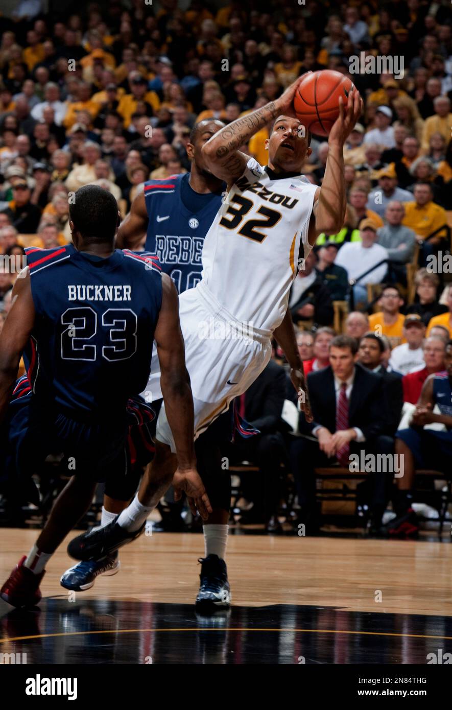 Missouri's Jabari Brown, right, is fouled by Mississippi's Reginald ...