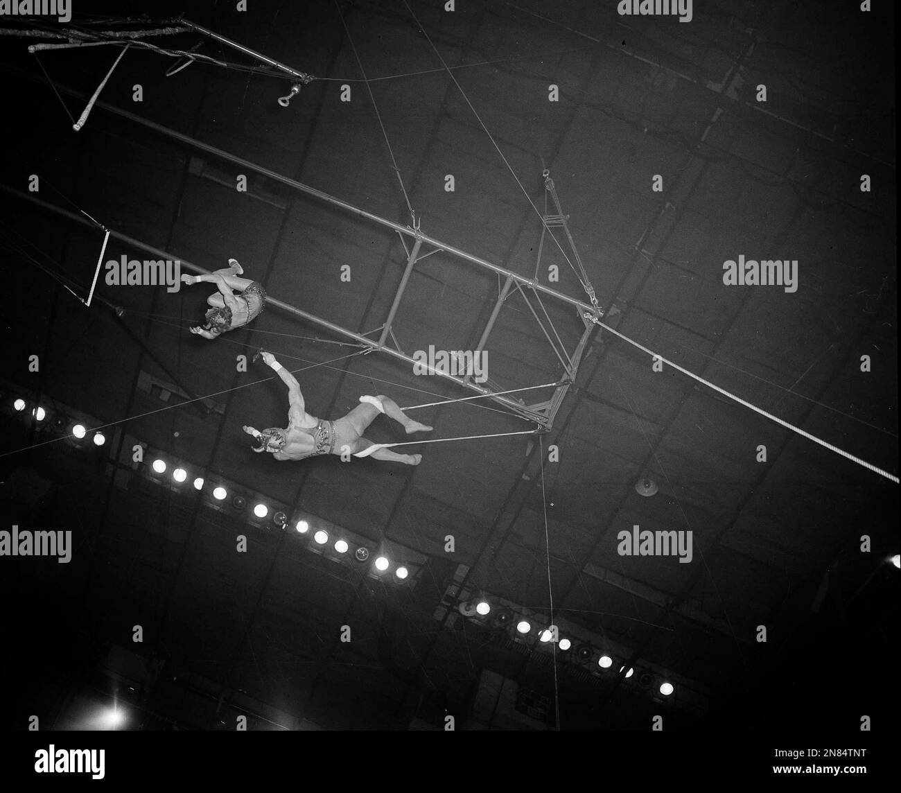 Roy of the "Flying Royals" is ready to catch Juanita as she flies ...