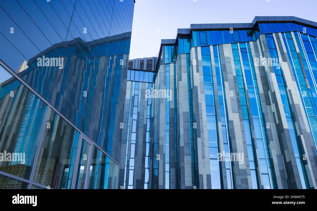 Blue glass facade of the modern university in Leipzig, Germany Stock ...