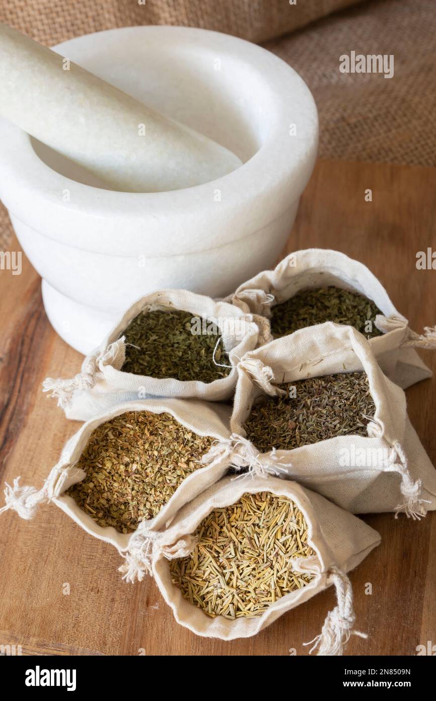 Herbs in jute bags sacks, rosemary, thyme, parsley, sage and oregano ...