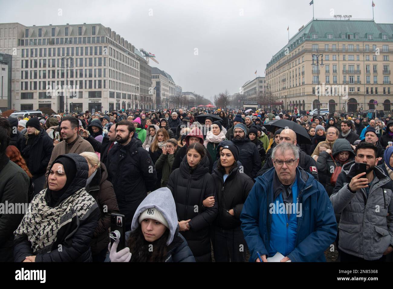 People attend a commemoration for the victims of the earthquake in ...