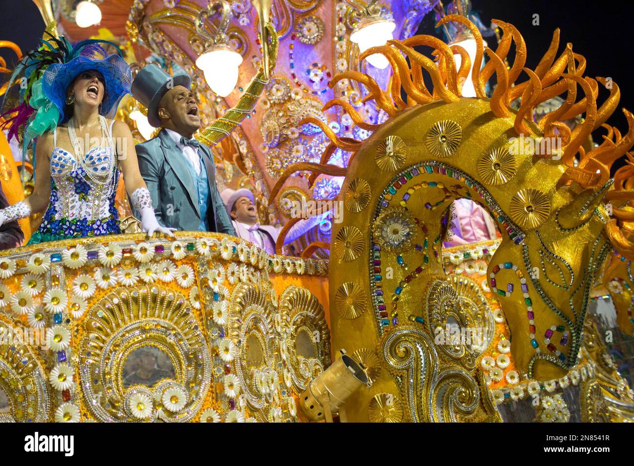 Performers from the Beija Flor samba school parade on a float during ...