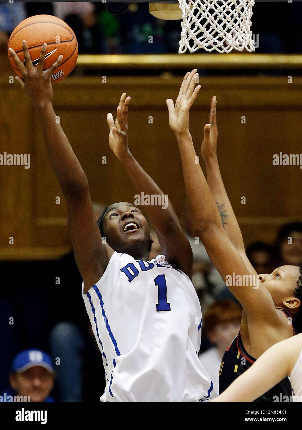 Duke's Elizabeth Williams (1) shoots as Maryland's Alicia DeVaughn ...