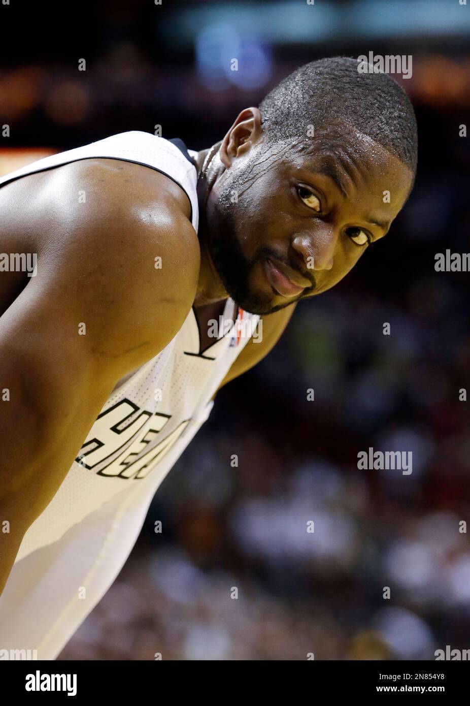 Miami Heat guard Dwyane Wade listens ot a fan during the first half of an NBA basketball game ...