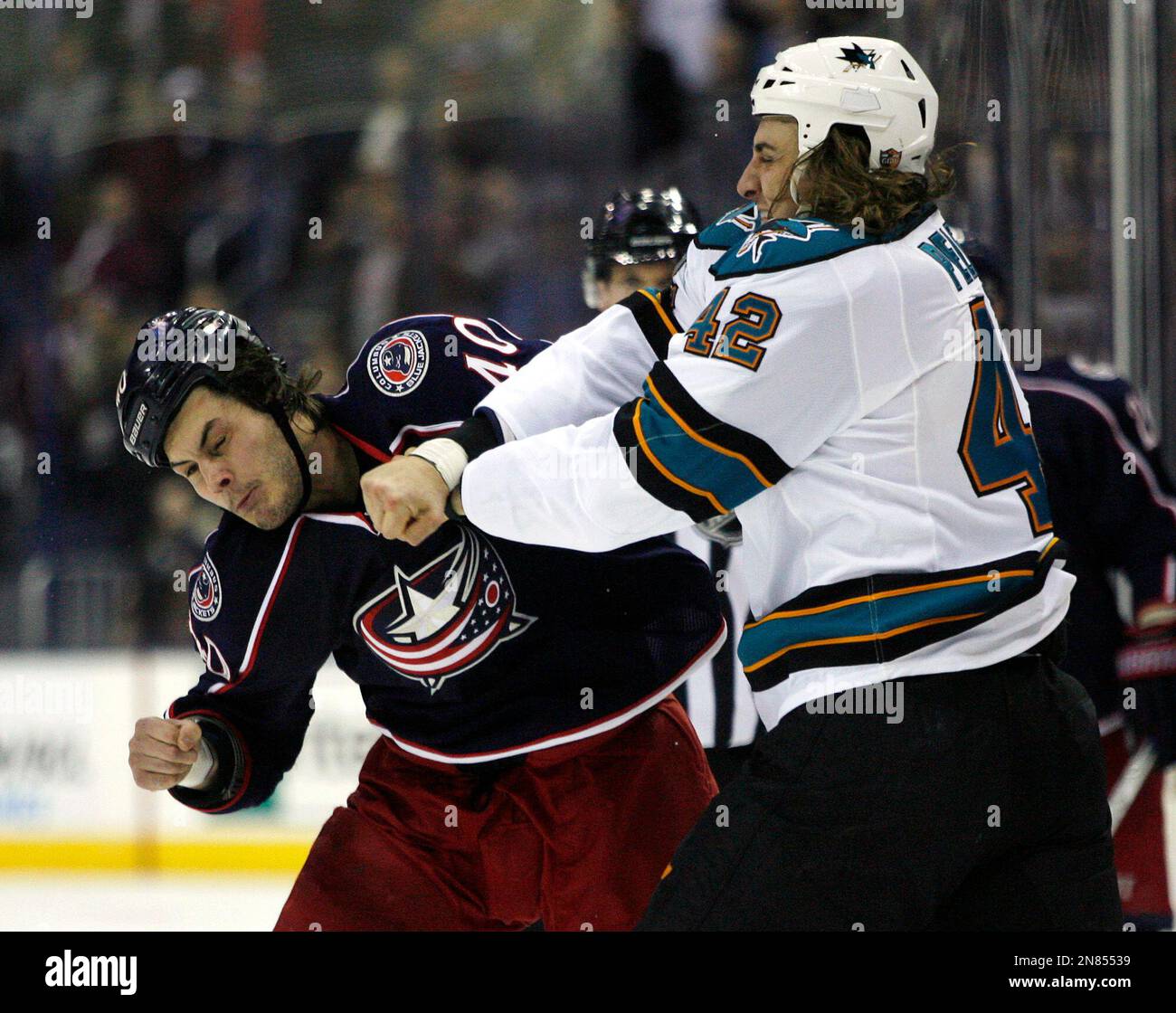 Columbus Blue Jackets' Jared Boll, left, and San Jose Sharks' Matt ...