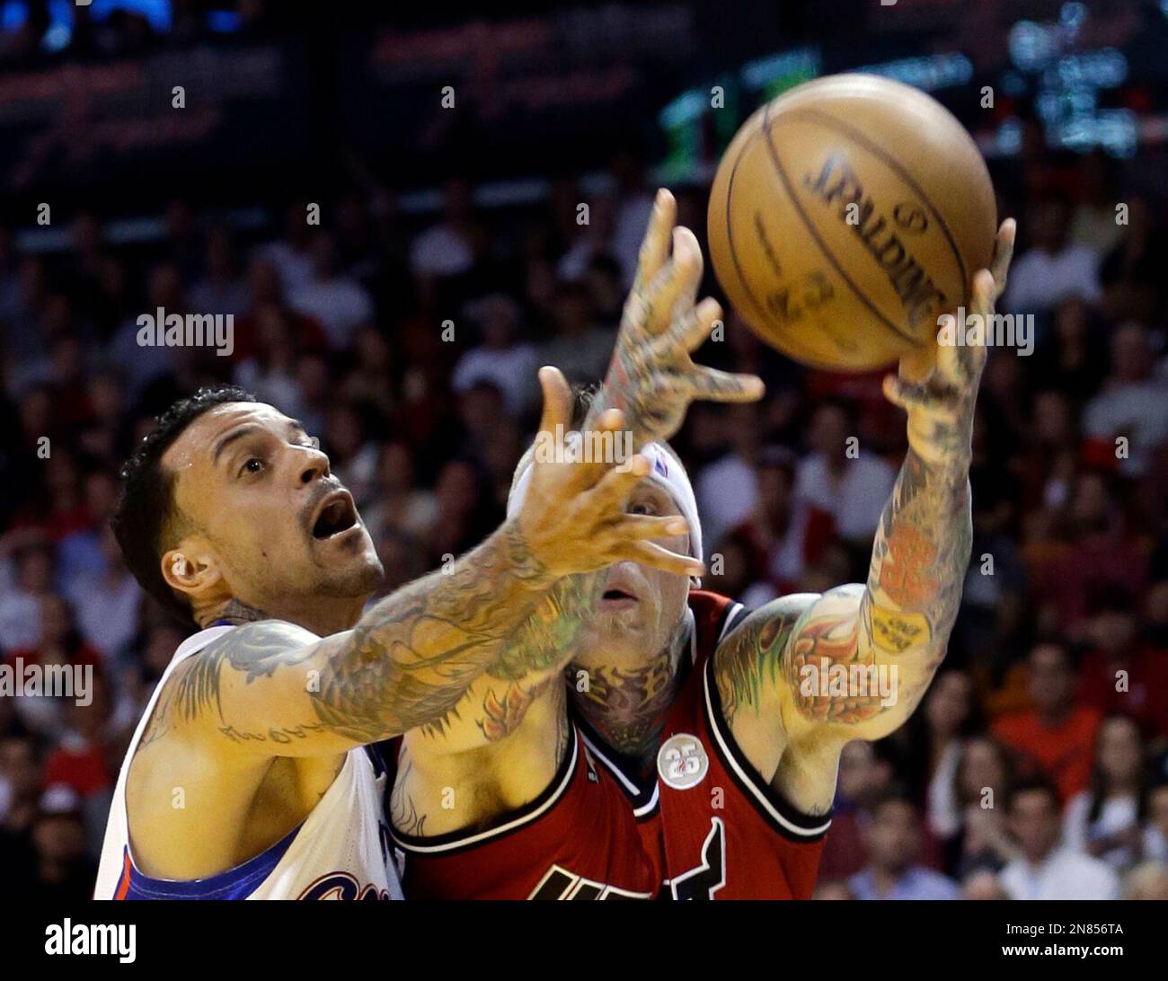 Los Angeles Clippers' Matt Barnes, left, battles Miami Heat's Chris ...